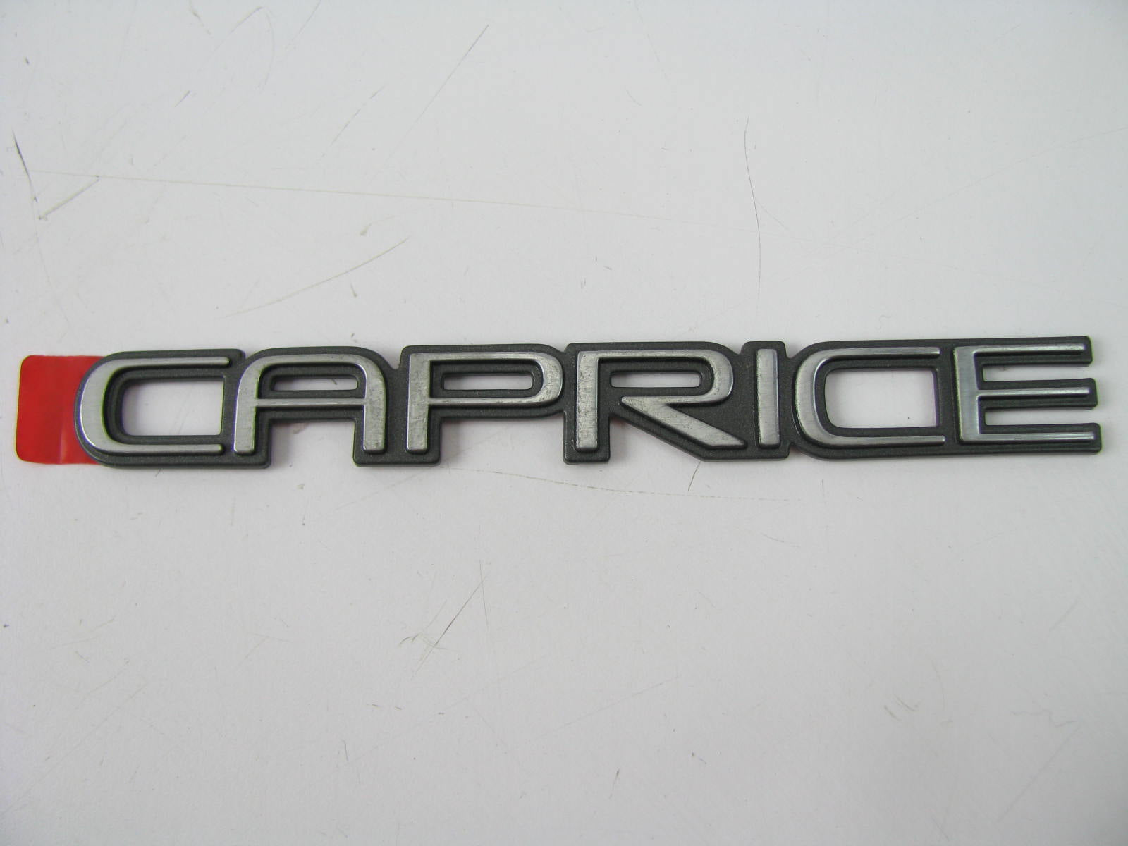 NEW - OUT OF BOX CAPRICE EMBLEM Name Plate Badge 5-1/2'' Long X 1/2 ...